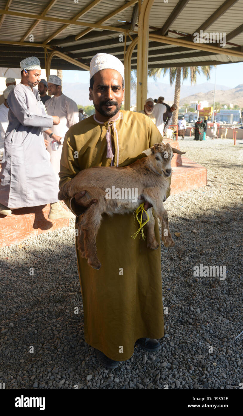 The busy Nizwa cattle market takes place every Friday morning by the ...