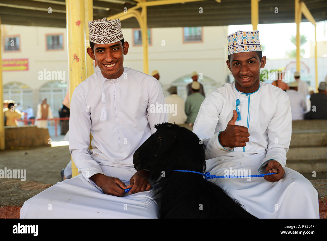 Omani boys wearing a traditional Kuma hat Stock Photo - Alamy