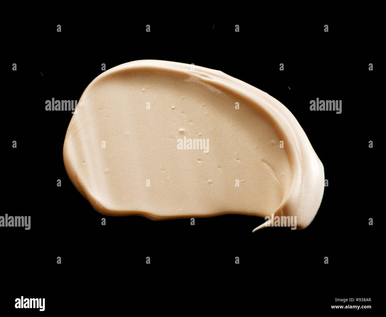 the texture of a foundation liquid, Black background Stock Photo - Alamy