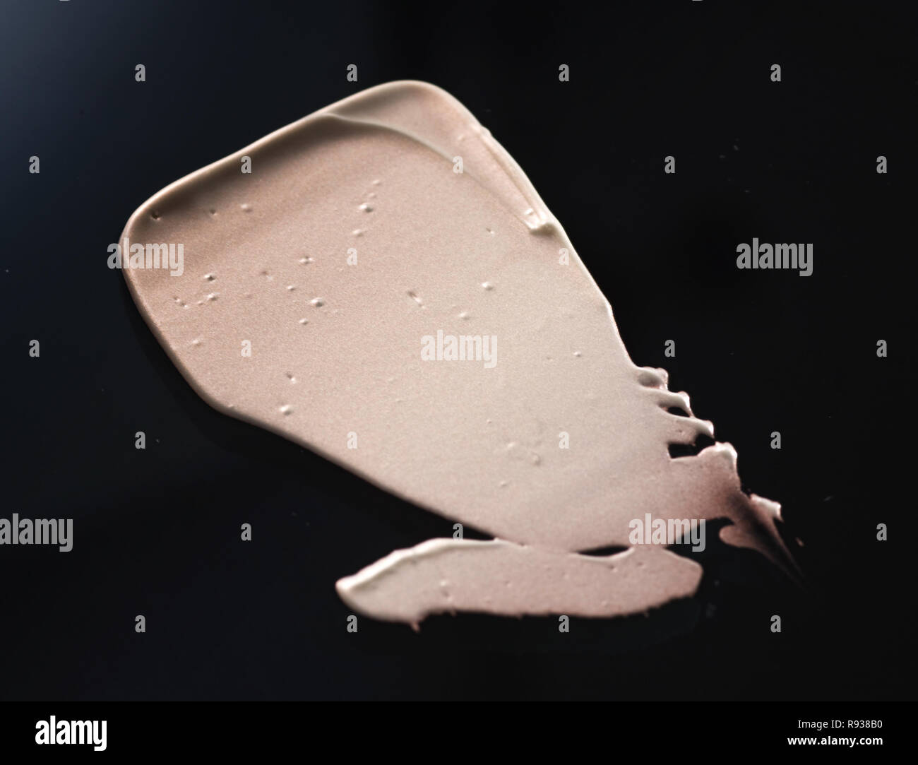 the texture of a foundation liquid, Black background Stock Photo - Alamy