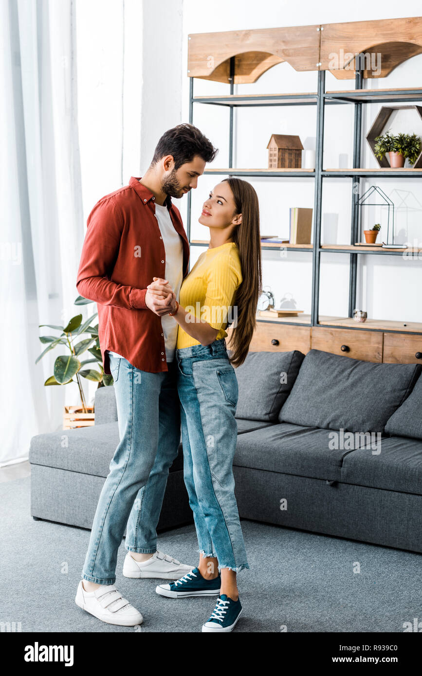 beautiful girlfriend dancing with boyfriend in living room Stock Photo ...