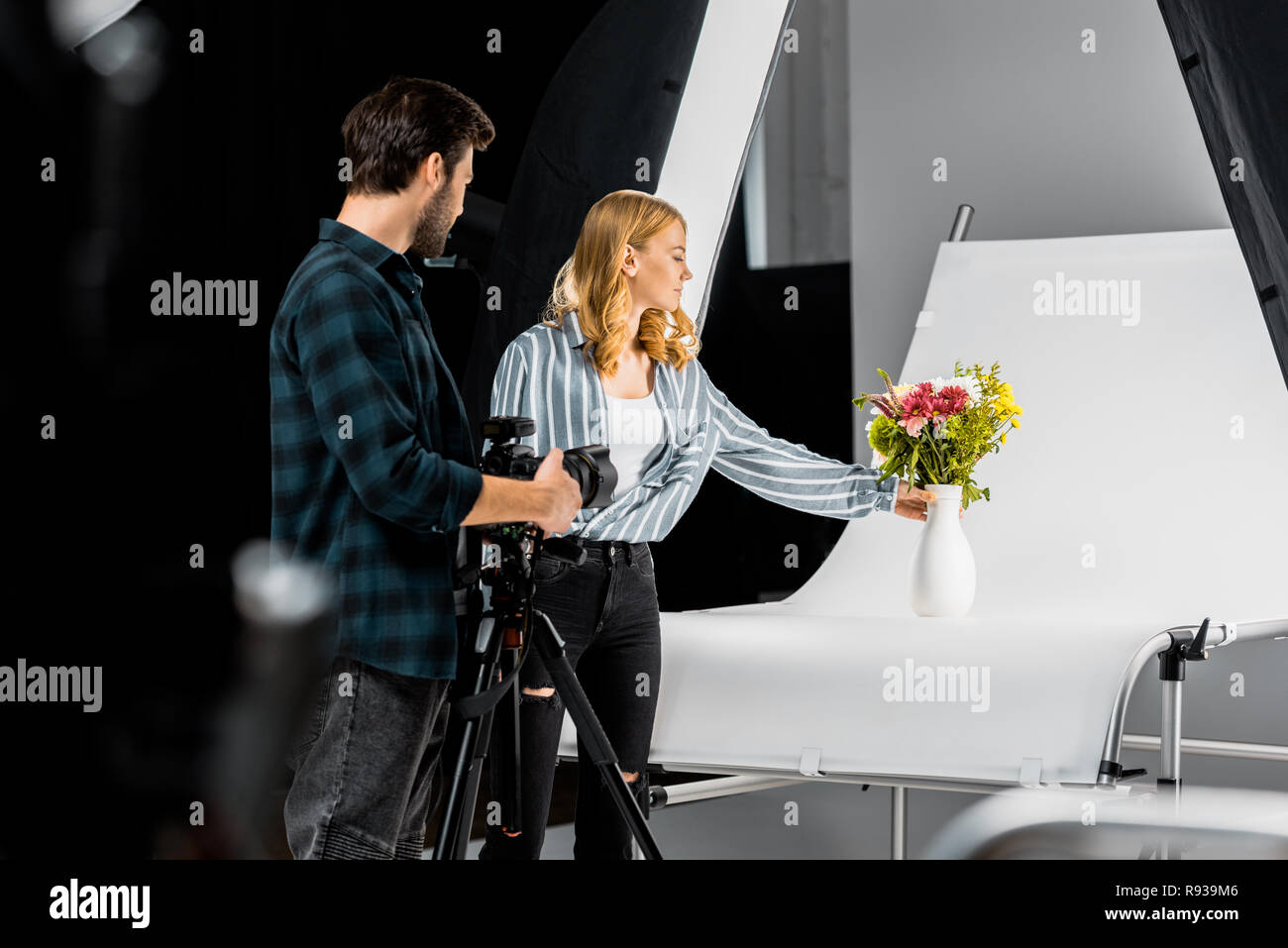professional young photographers shooting beautiful flowers in photo ...