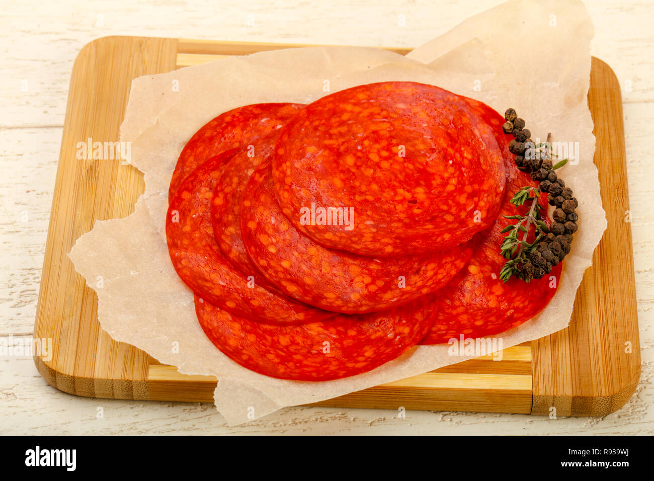 Sliced chorizo saucage over the wooden background Stock Photo - Alamy