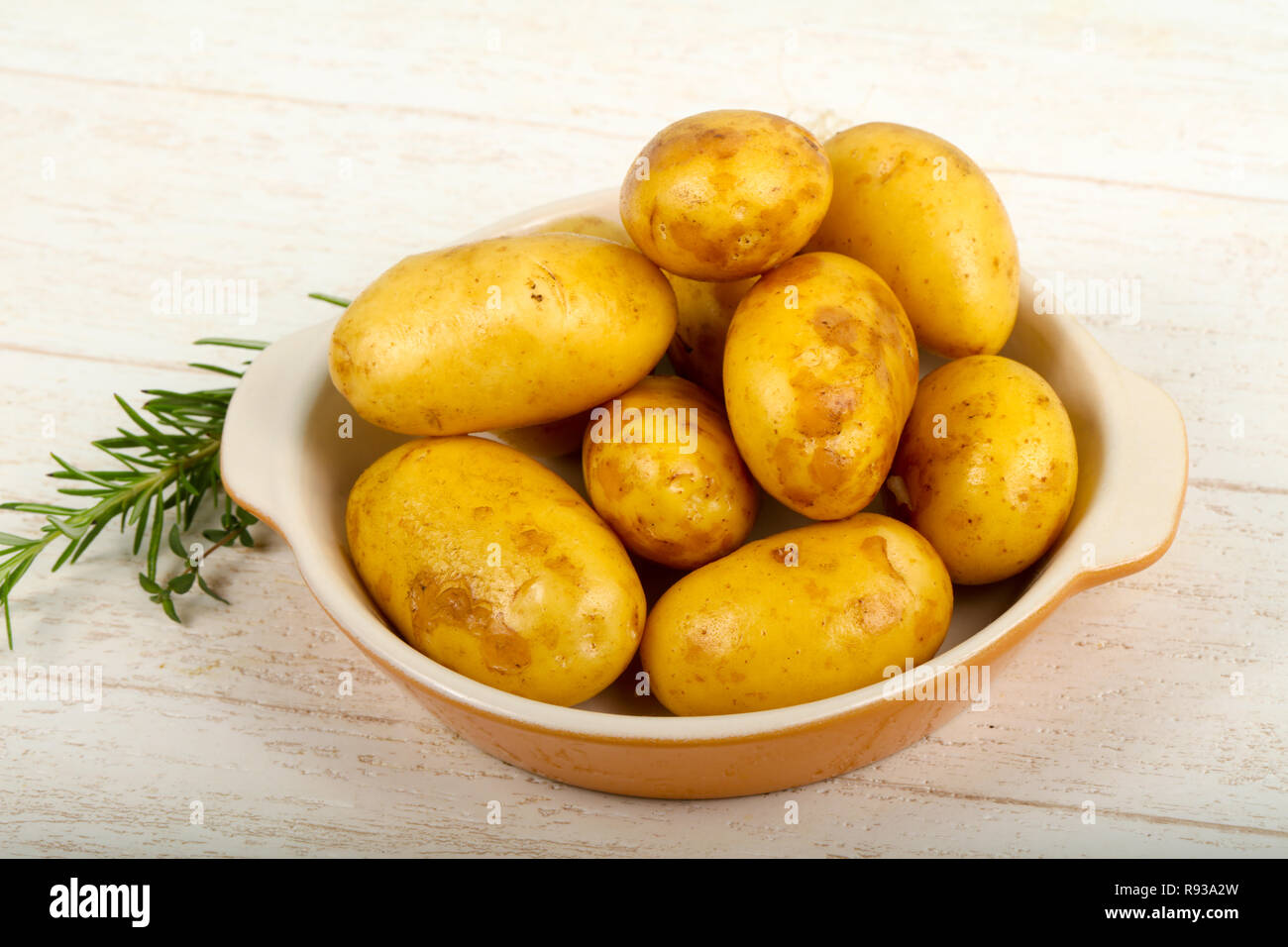Raw young potato with herbs Stock Photo - Alamy