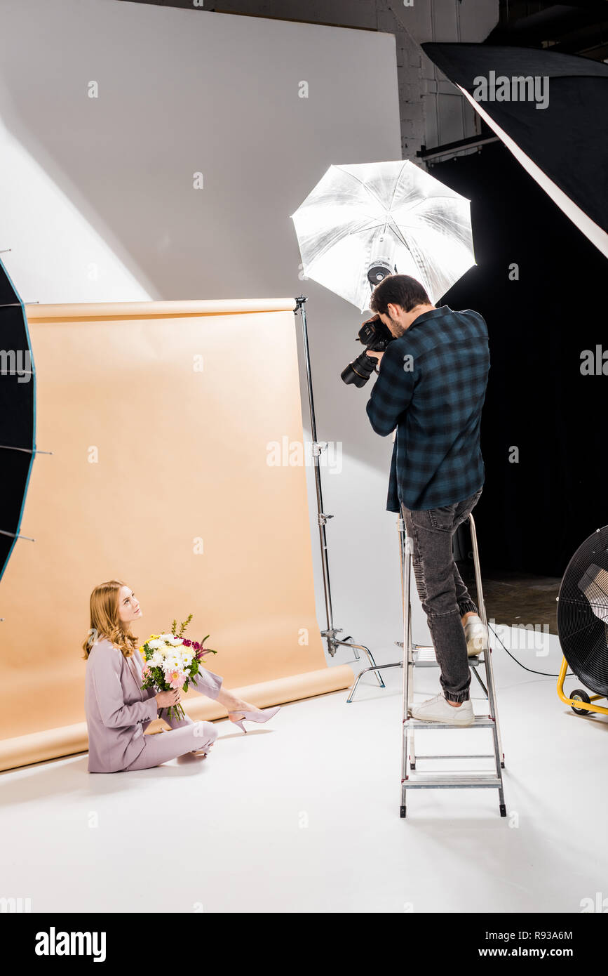 Woman standing on step ladder hi-res stock photography and images - Alamy