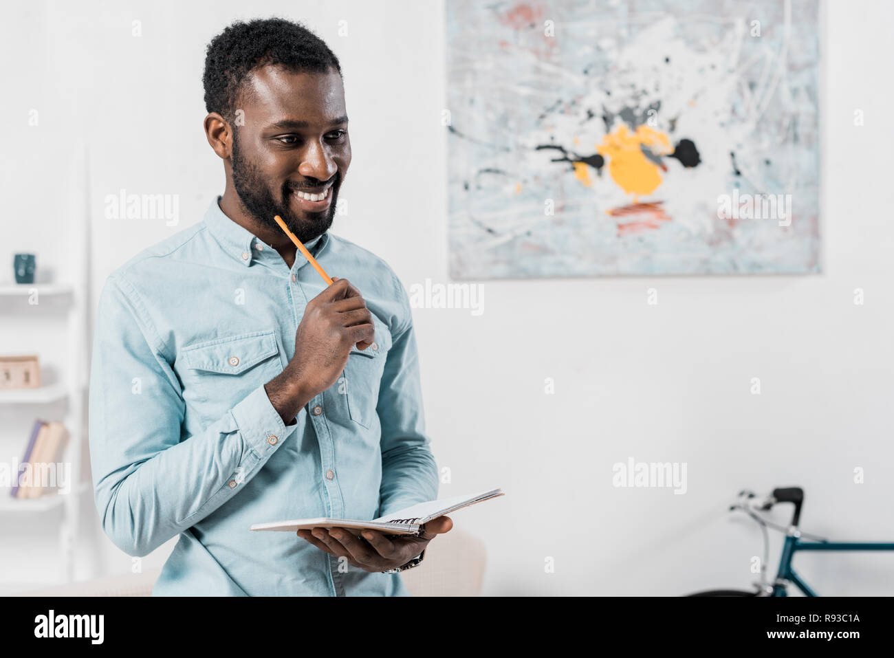 Man holding pencil hi-res stock photography and images - Alamy