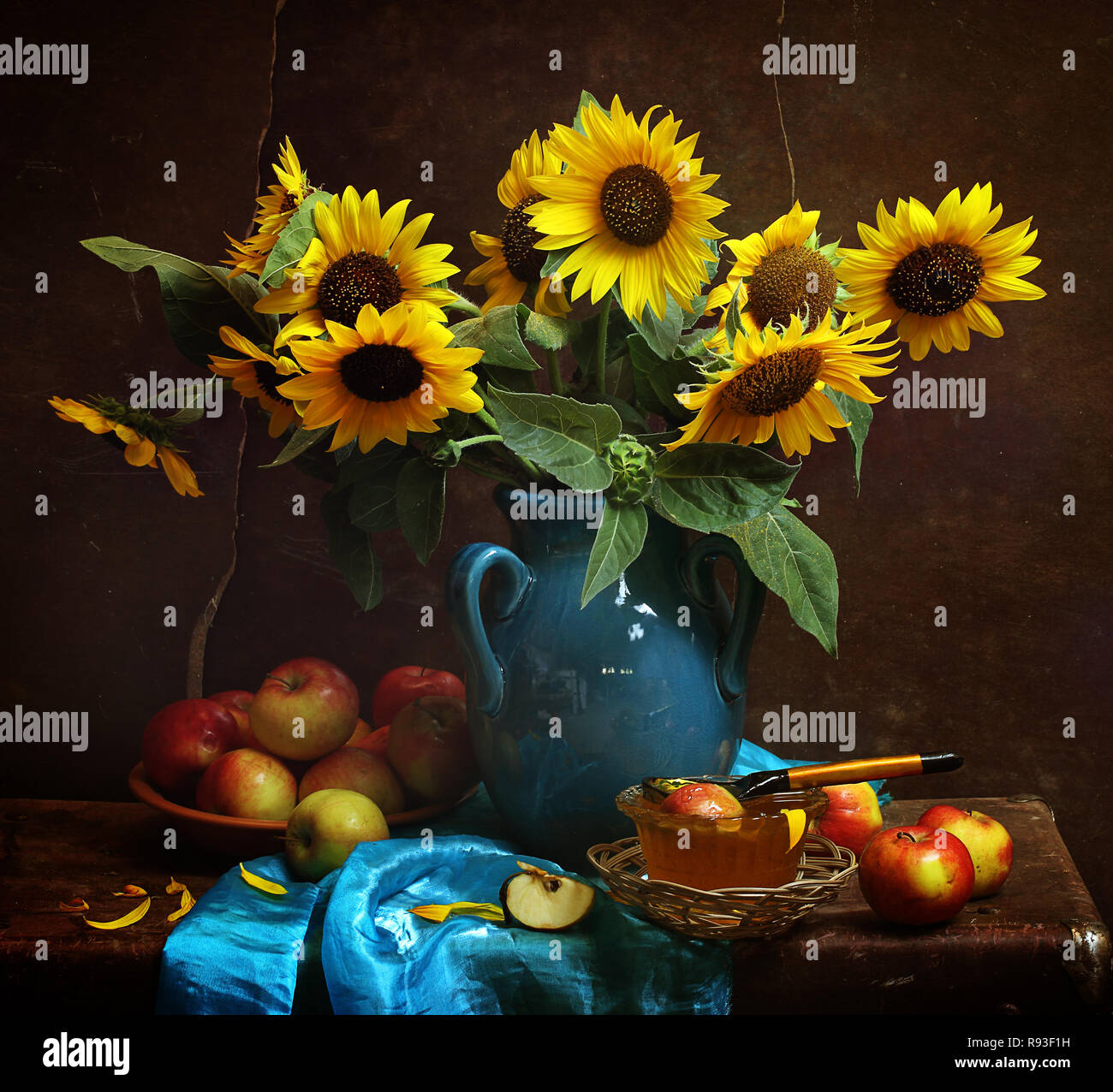 Still life with a bouquet of sunflowers, apples and honey Stock Photo ...