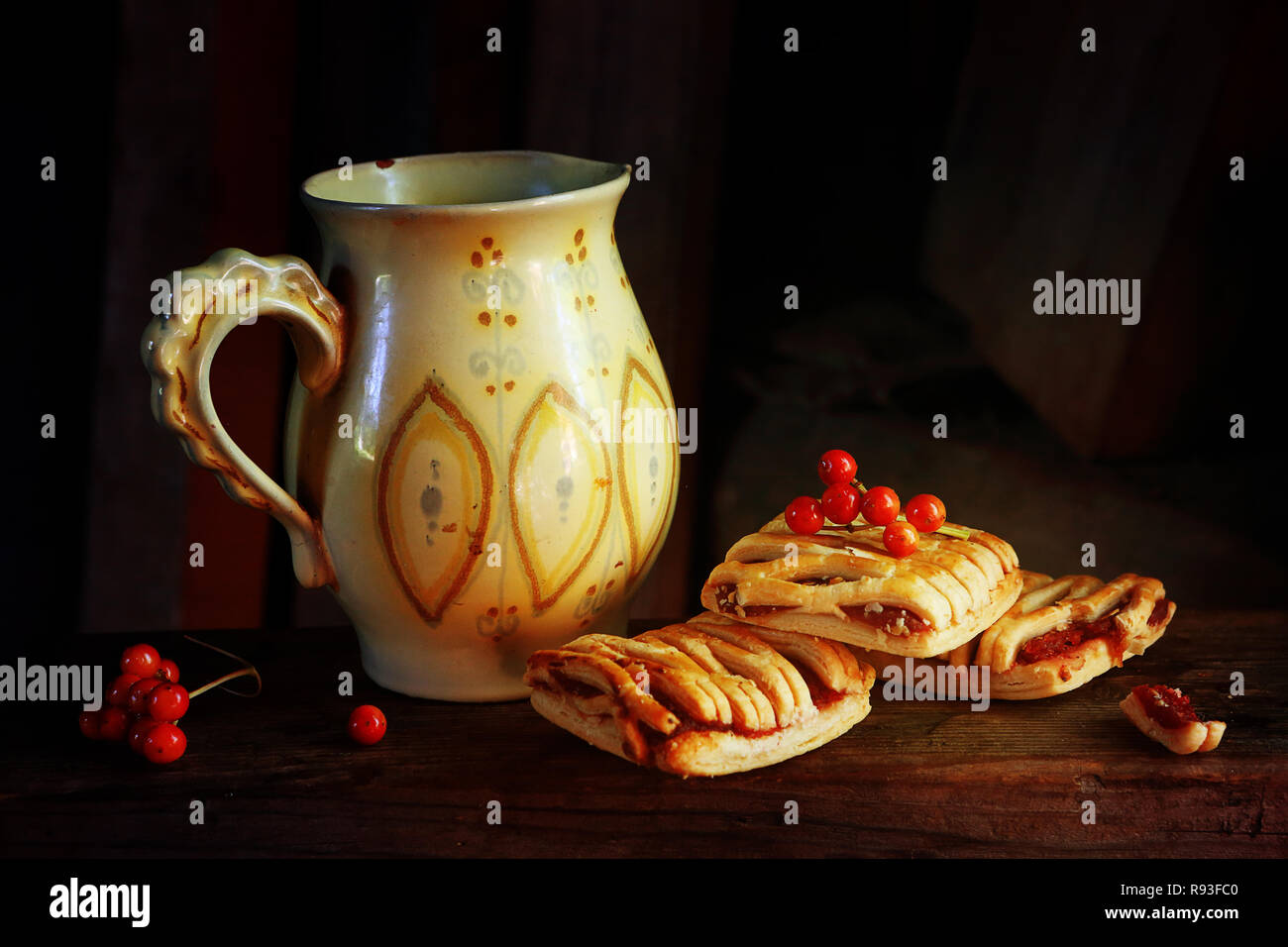 Still Life with Jug. Viburnum and Puff Pastry Cakes Stock Photo - Alamy