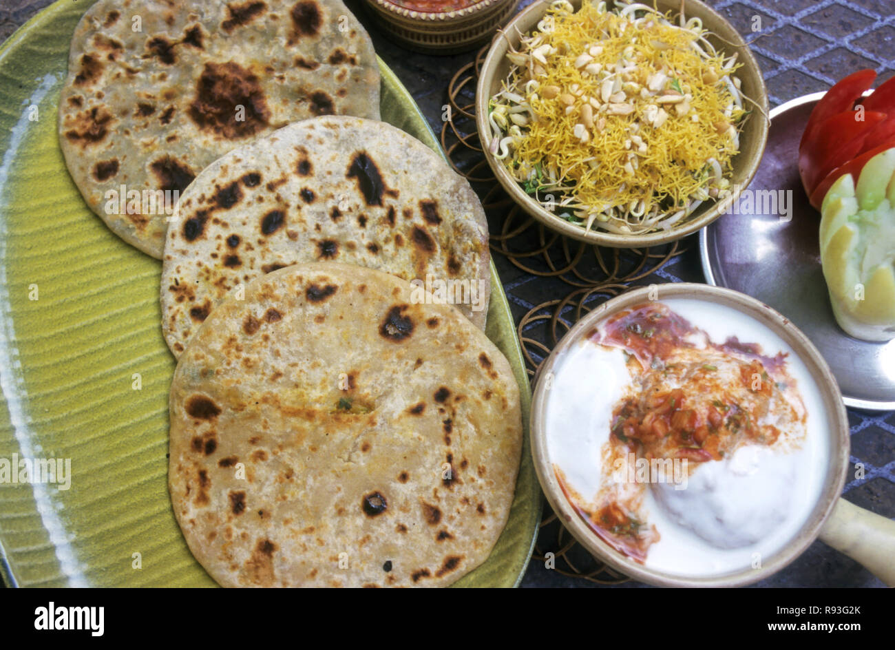 Vegetarian Thali - Aloo Parathas Stock Photo - Alamy