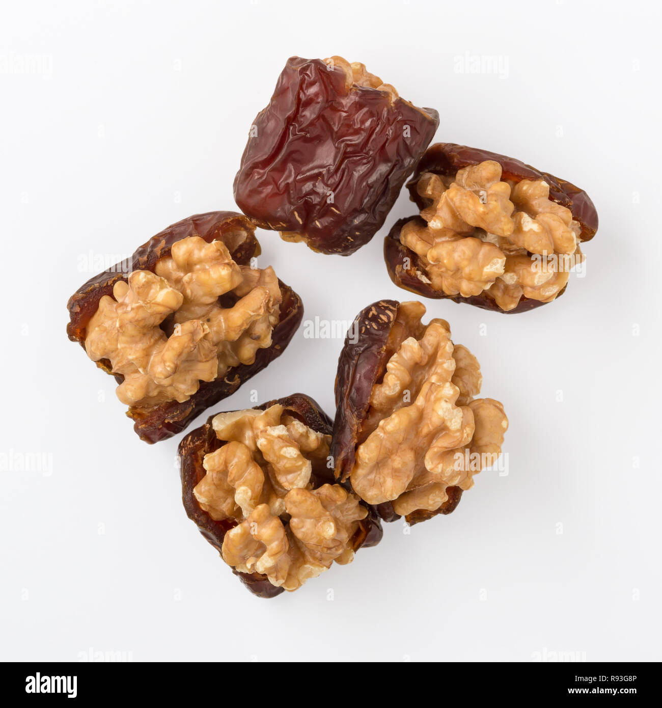 Walnuts with dried date fruit isolated on white background, healthy ...