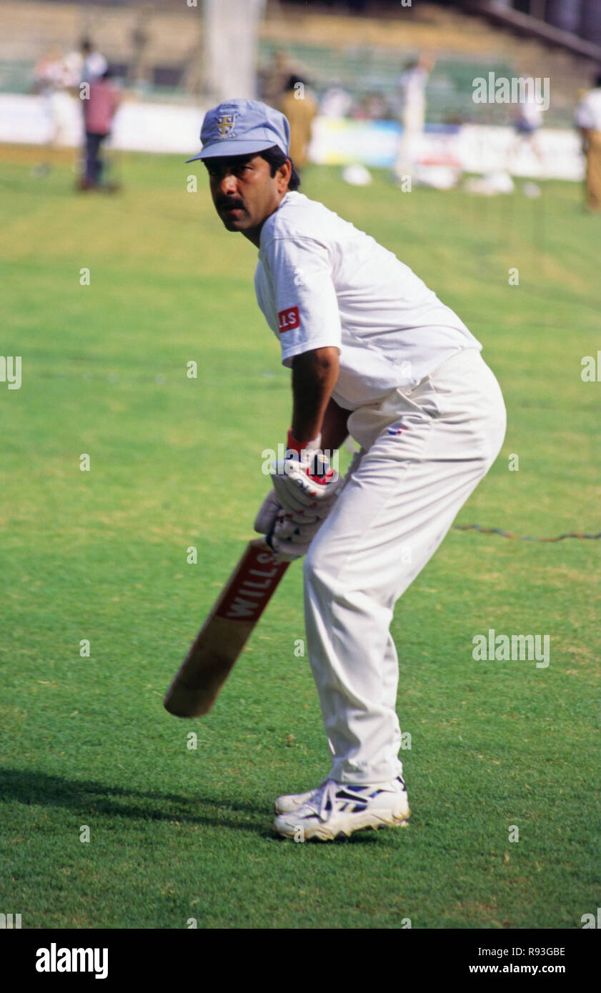 Portrait cricket player holding bat hi-res stock photography and images ...