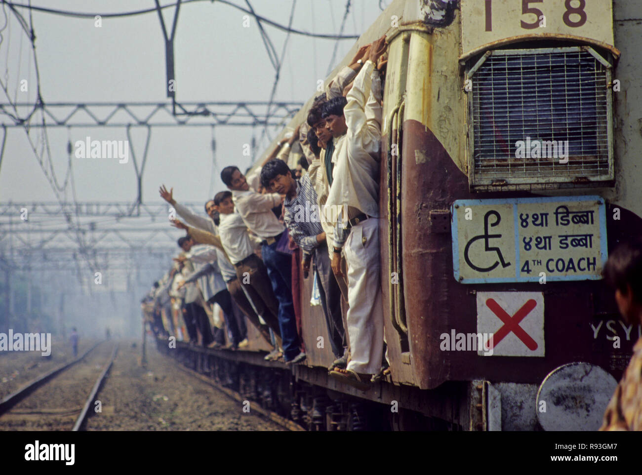 People traveling in suburban Local Trains Railways, bombay mumbai ...