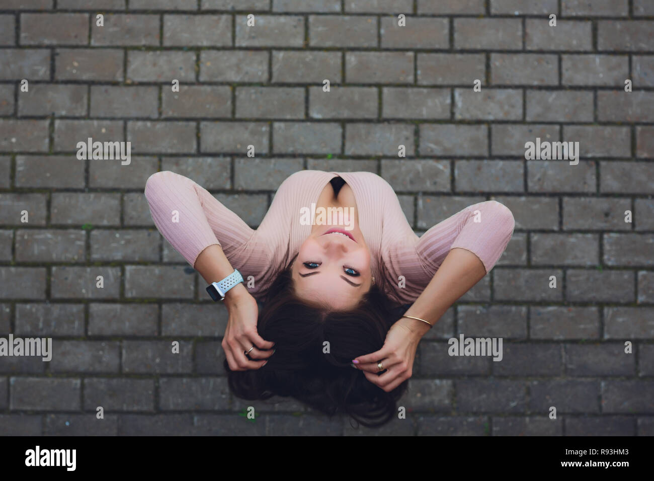 Young smiling teen girl looking camera. Shot from above Stock Photo - Alamy