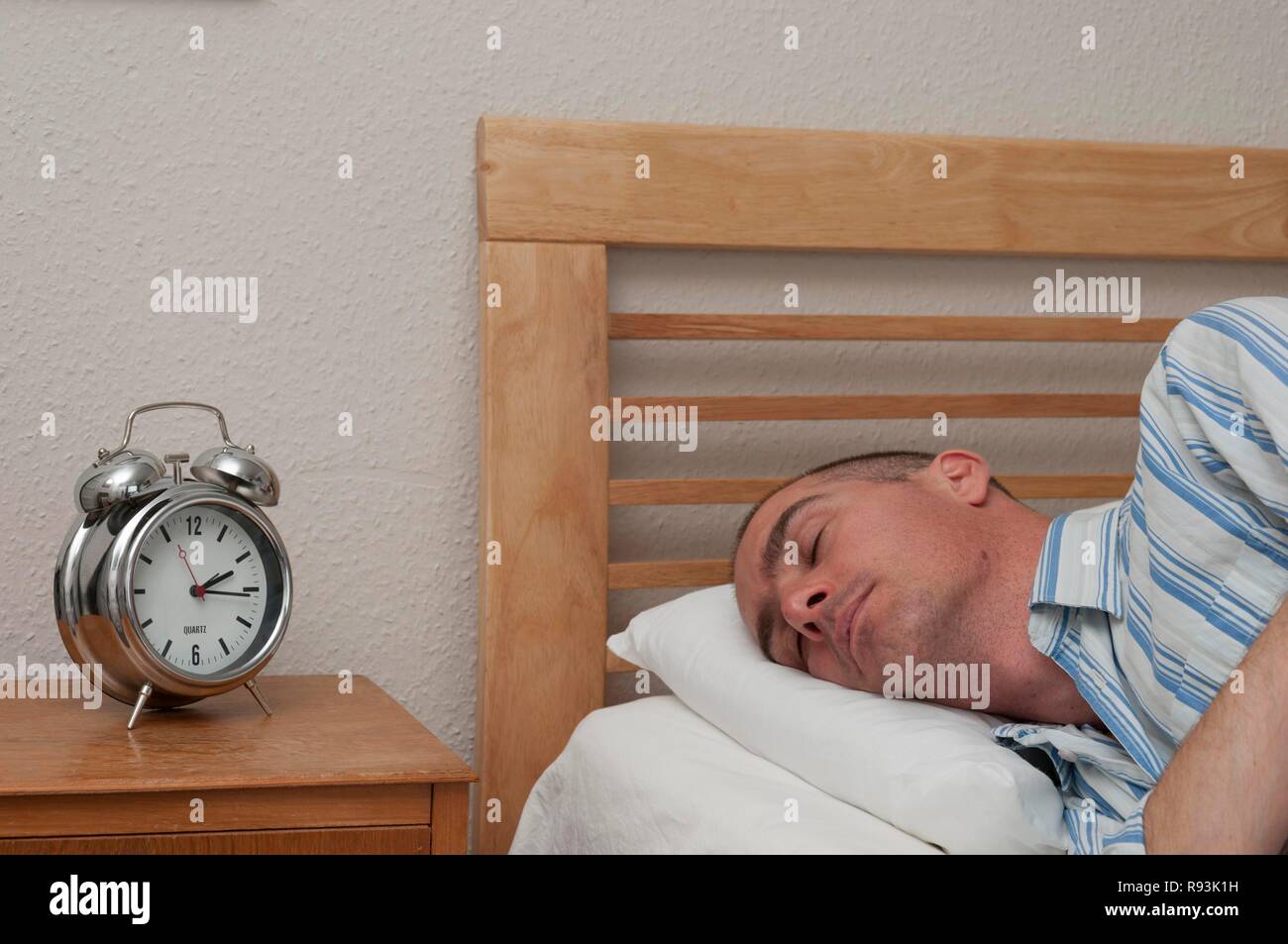Afternoon nap man clock hi-res stock photography and images - Alamy