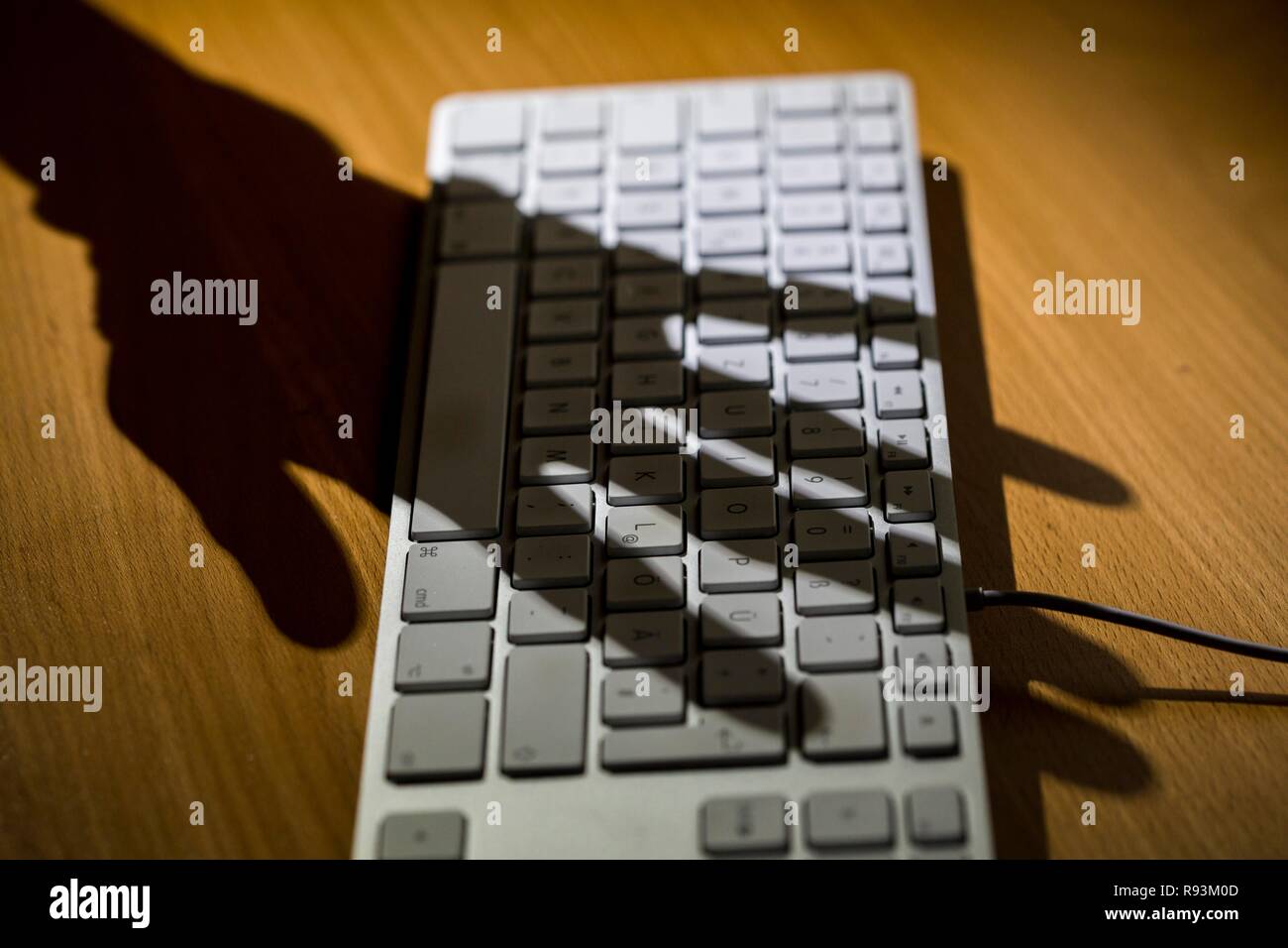 Person on computer shadow hi-res stock photography and images - Alamy