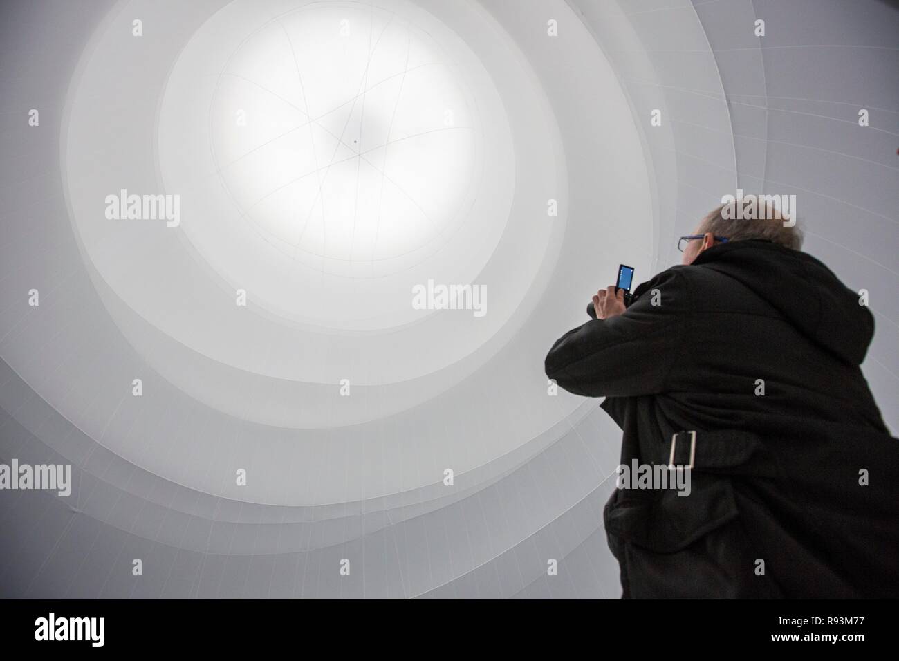 Visitor taking a picture of an installation by Christo, 90 meters high ...