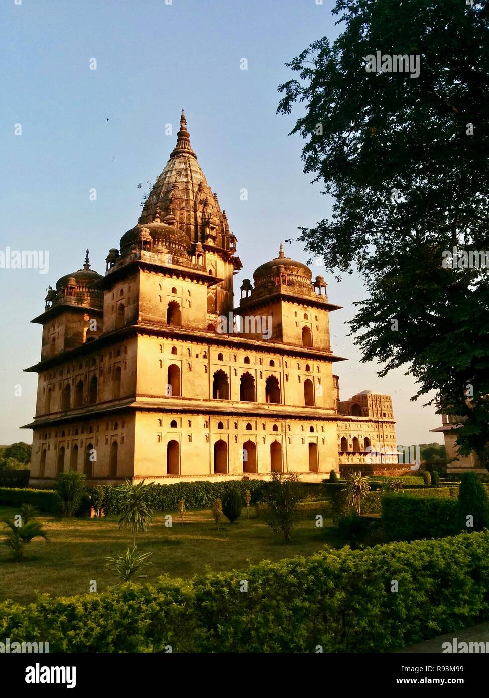An Indian temple glowing in the afternoon sun in a remote village Stock ...