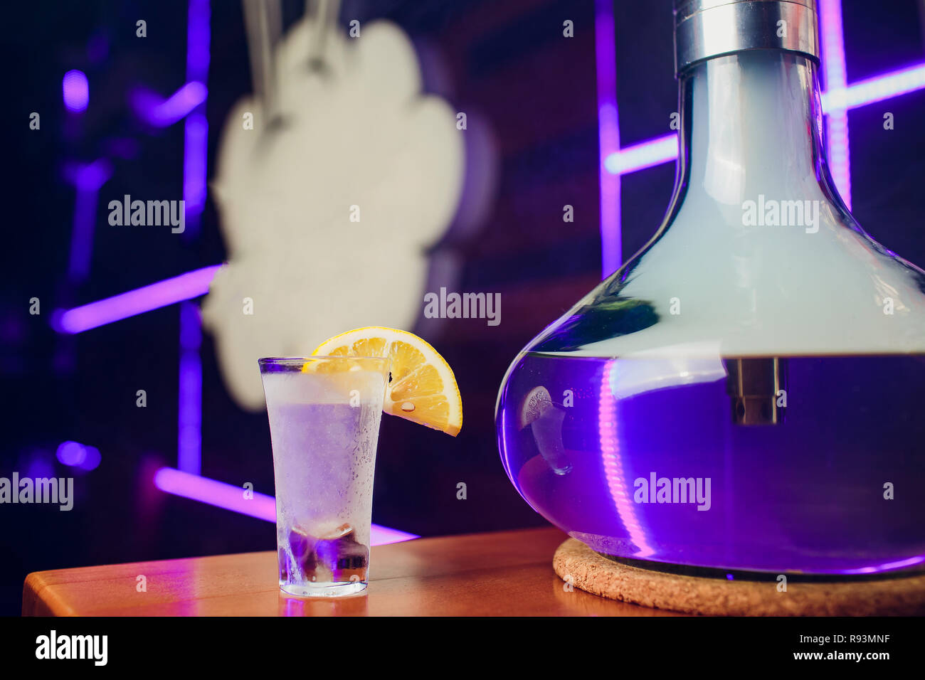 Girls hand holding straw in lime juice Stock Photo - Alamy