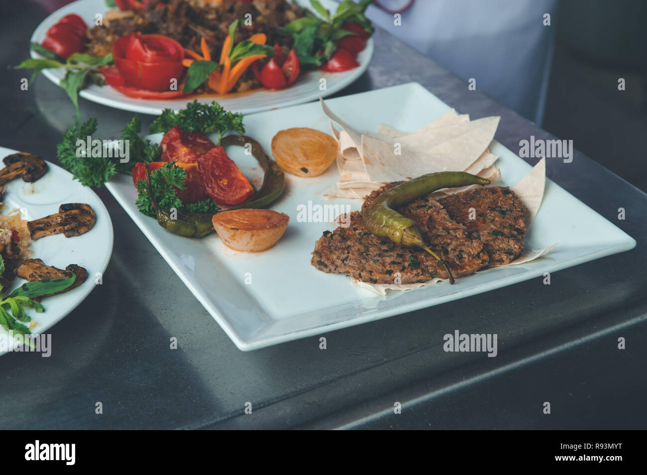 Turkish Paper Kebab (Kagit Kebap) served in a white plate with ...