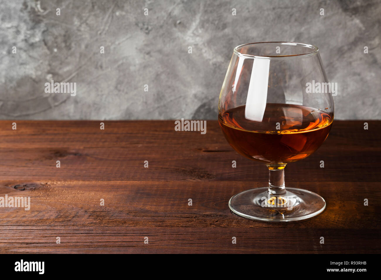 Cognac in glass on wooden background. Copy space. Food background Stock ...