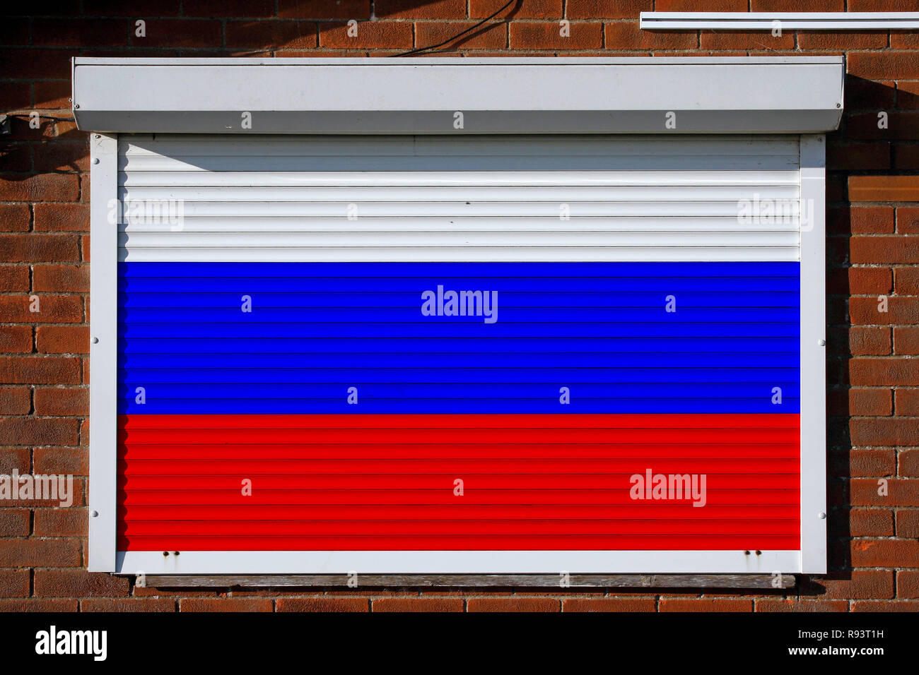 Russian flag on closed steel security shutters Stock Photo - Alamy