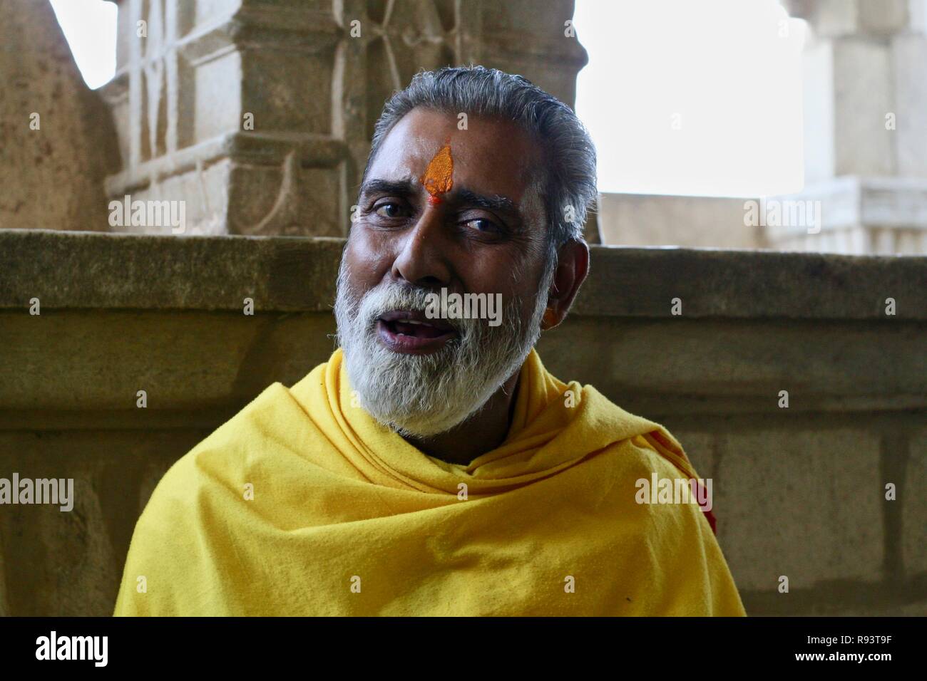 The Jain High priest singing a blessing in his temple in Rajasthan ...