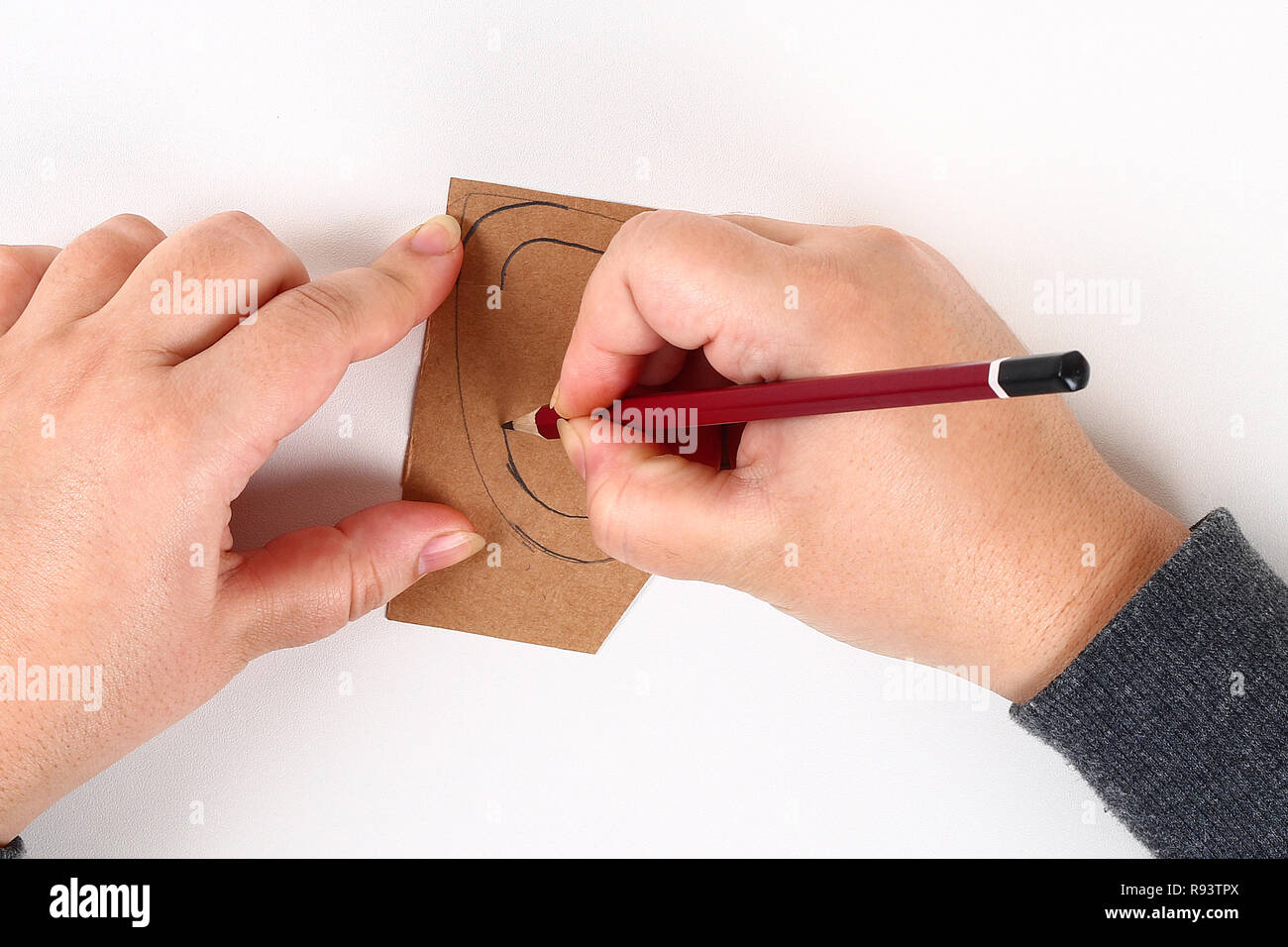 Red handmade diy hearts made of cardboard, yarn on a white background ...