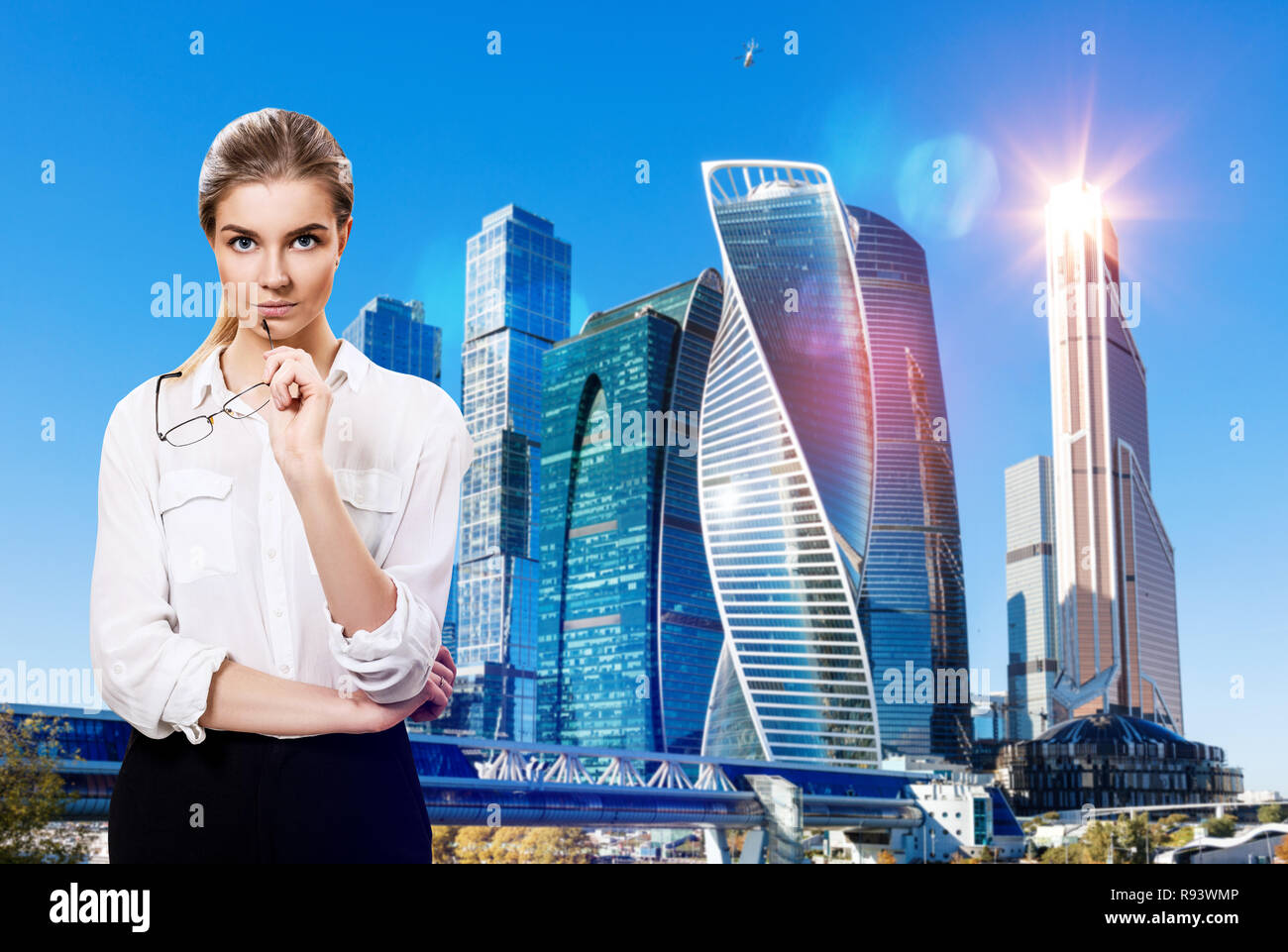 Business woman stands over cityscape background Stock Photo - Alamy