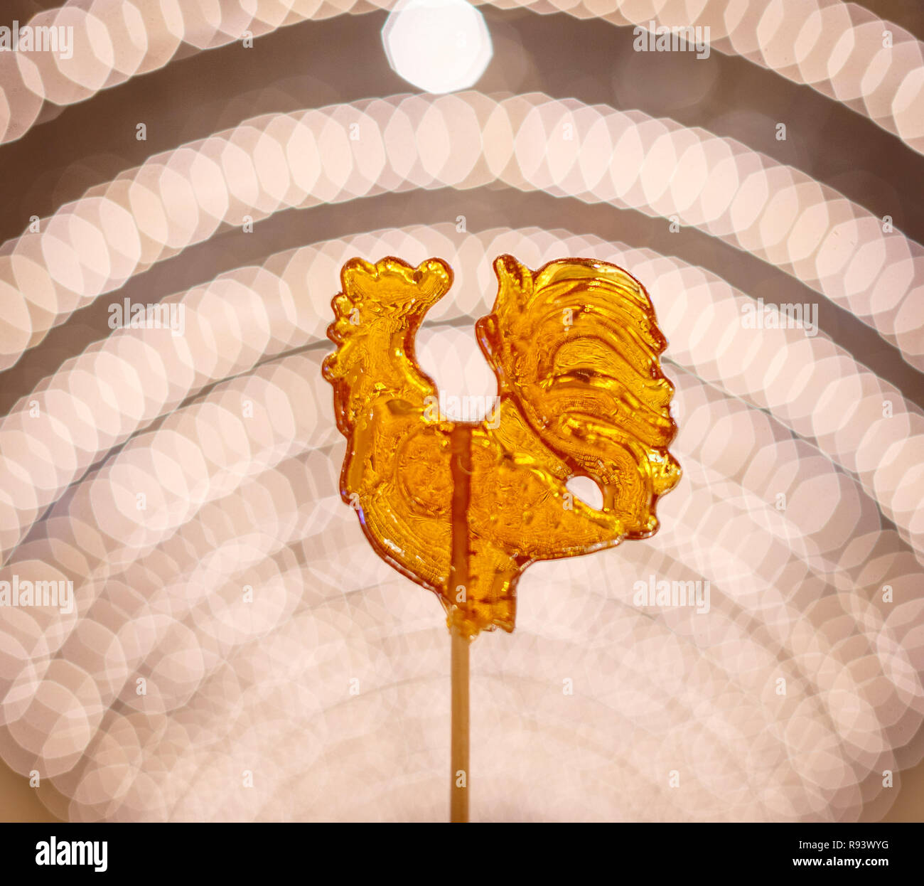 Cockerel candy on a stick. Hard candy rooster. Rooster candy symbol ...