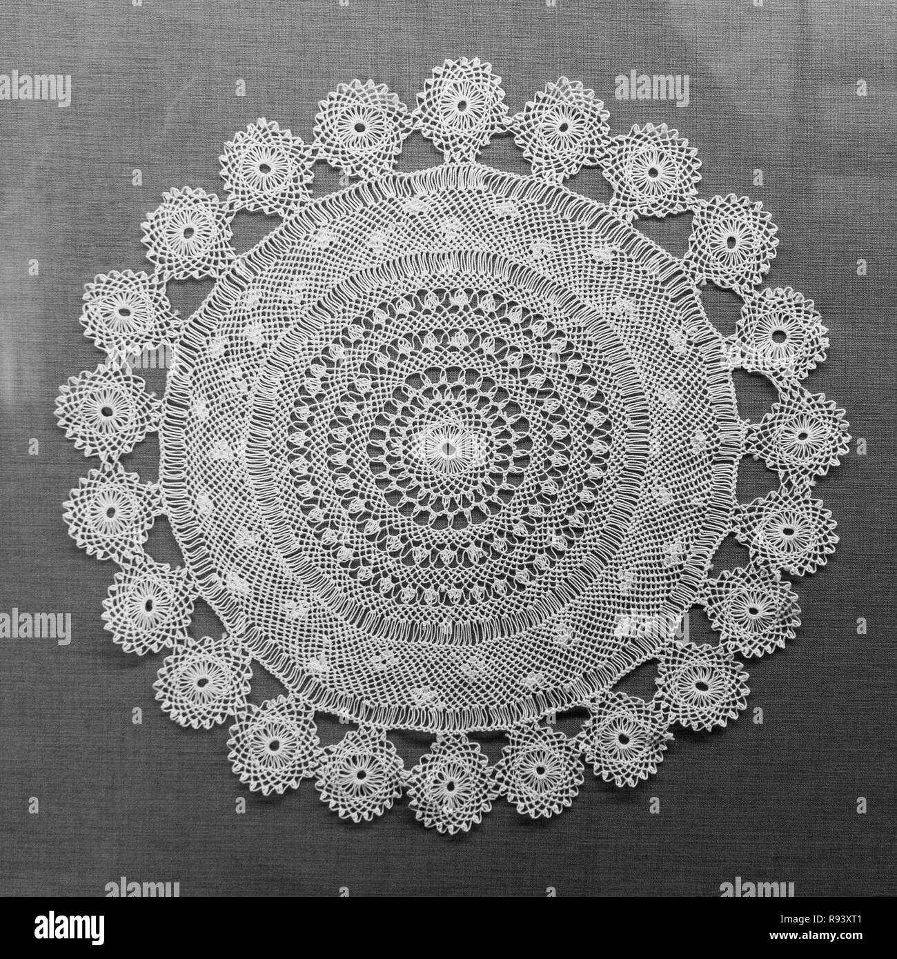 Handmade lace on black background Stock Photo - Alamy
