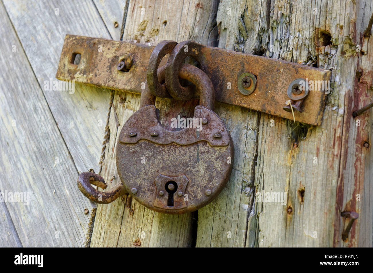 Old lock on the door. lock on the door of an old farmhouse . true ...