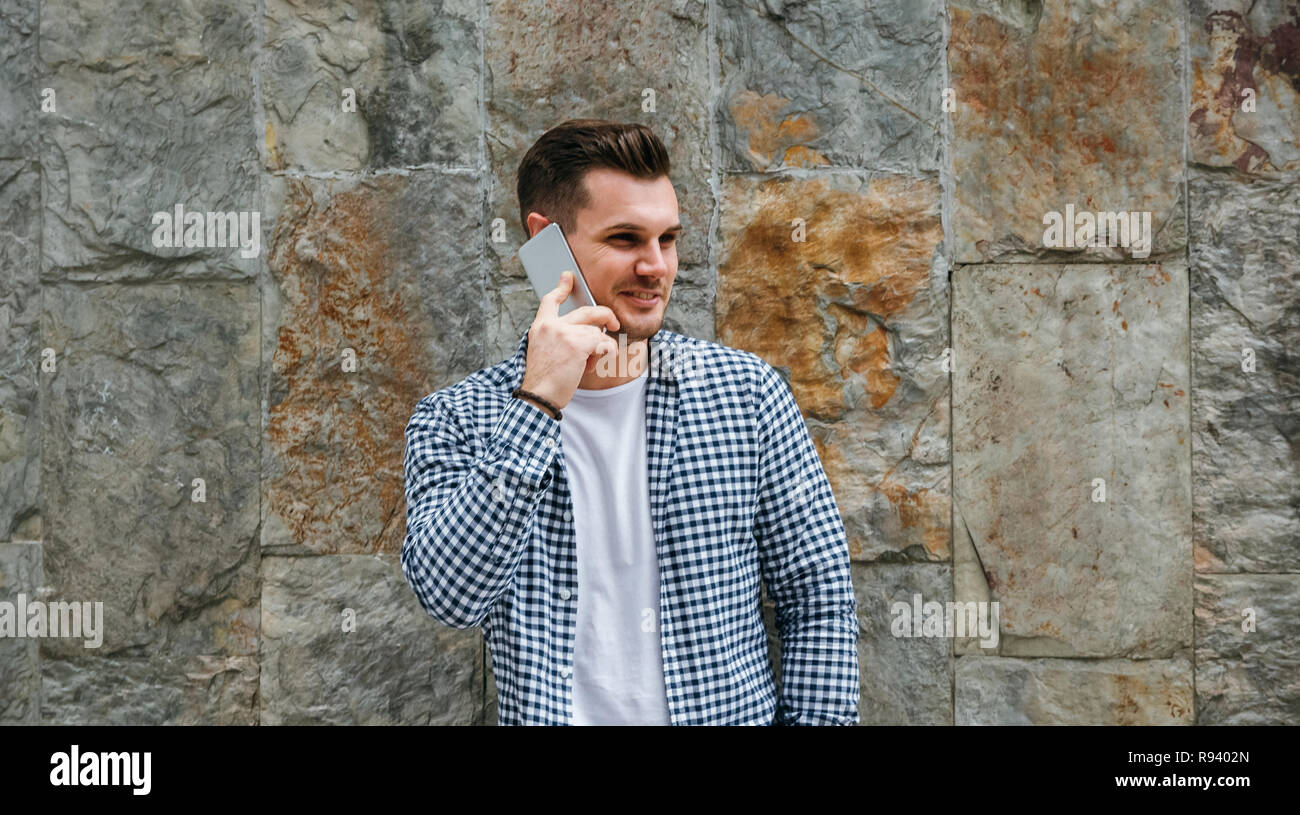 Handsome smiling man talking hi-res stock photography and images - Alamy