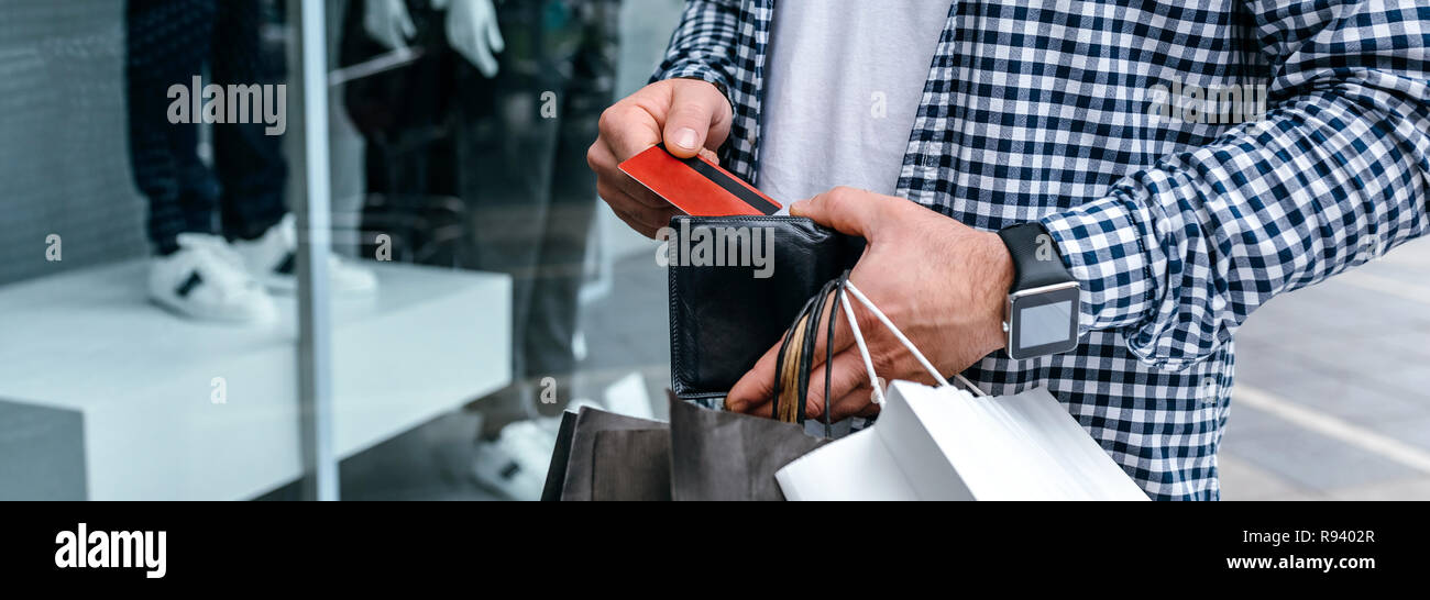Man taking out credit card Stock Photo - Alamy
