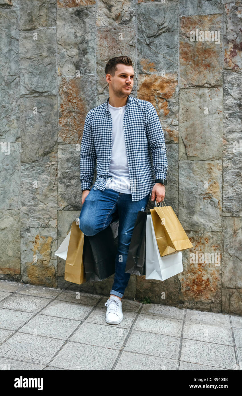 Man shopping bags hi-res stock photography and images - Alamy