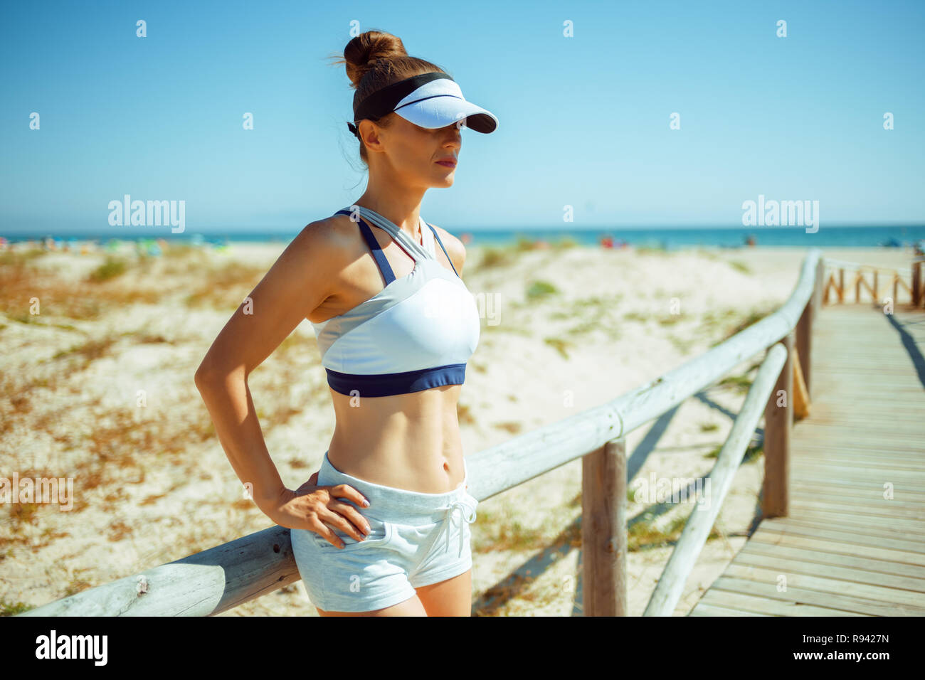 Athletic woman beach relaxing enjoying hi-res stock photography and ...