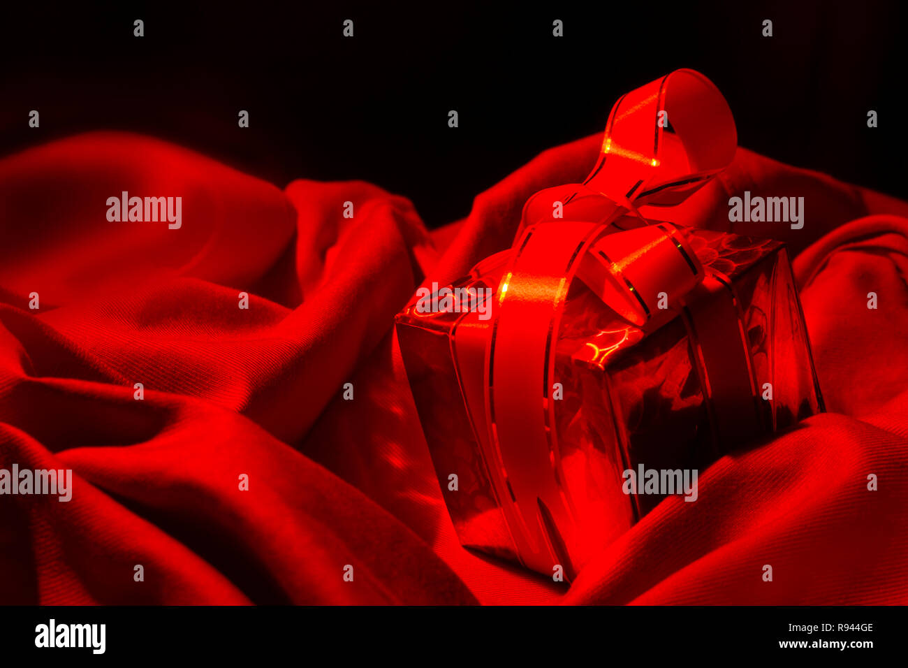 Gift in intimacy valentine's day in red sheet bed fabric. A red gift ...