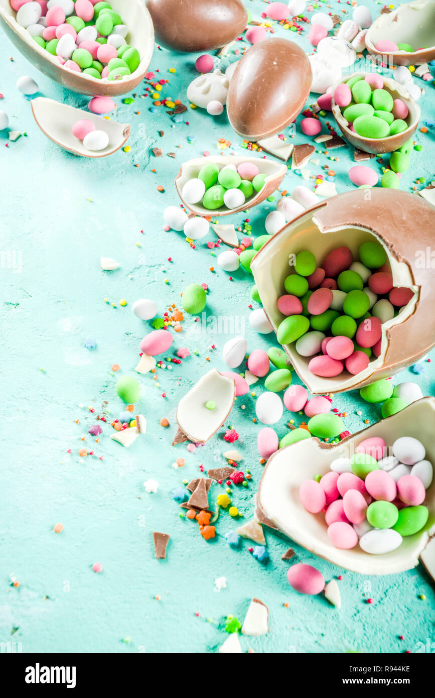 Colorful spring easter sweets background, with chocolate eggs, sugar ...