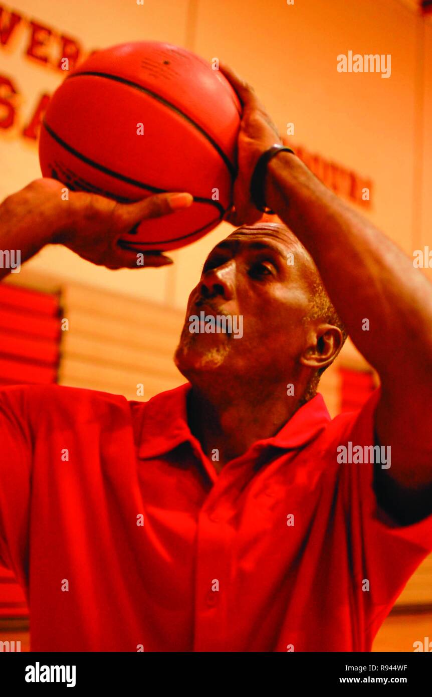 Black male model poses for pictures with a basketball Stock Photo - Alamy