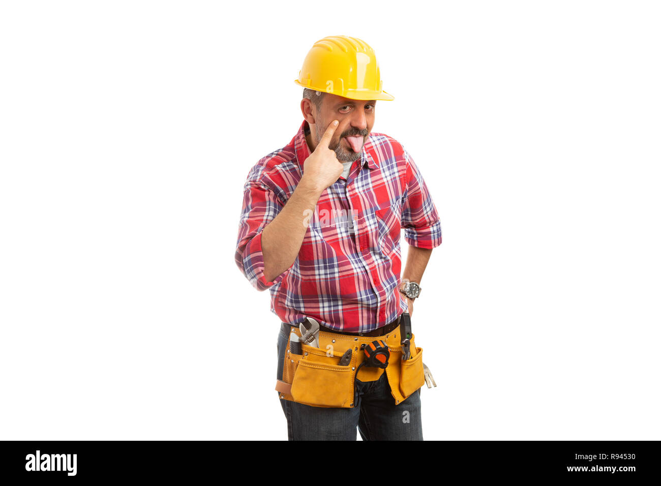 Friendly constructor pulling eyes with index finger as joke gesture ...