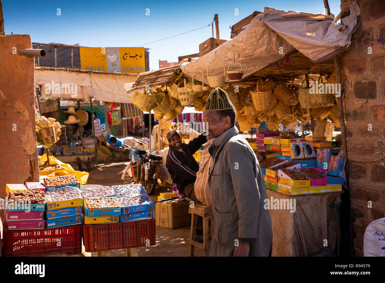 Morocco, Agdz, town centre, local market, trader and shopper amongst ...