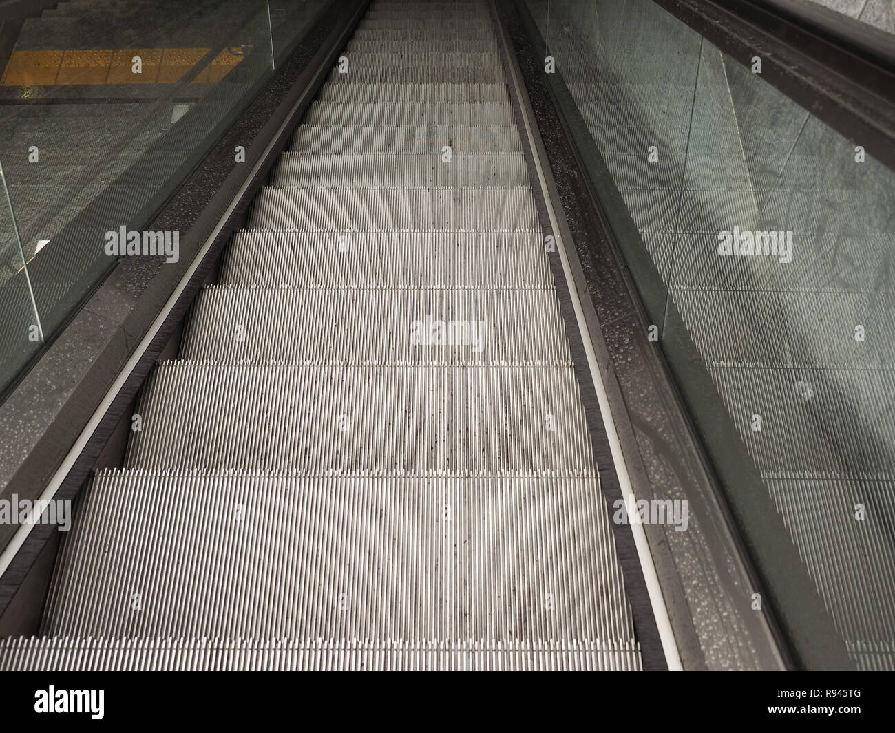 escalator moving staircase to carry people between floors of a building ...