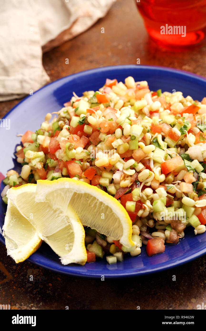 Tabbouleh salad with mung bean sprouts, lemon, and vegetables Stock ...