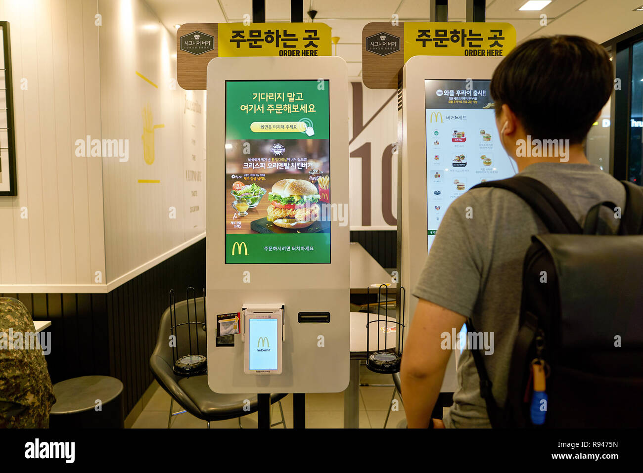 BUSAN, SOUTH KOREA - CIRCA MAY, 2017: man use ordering kiosk at ...