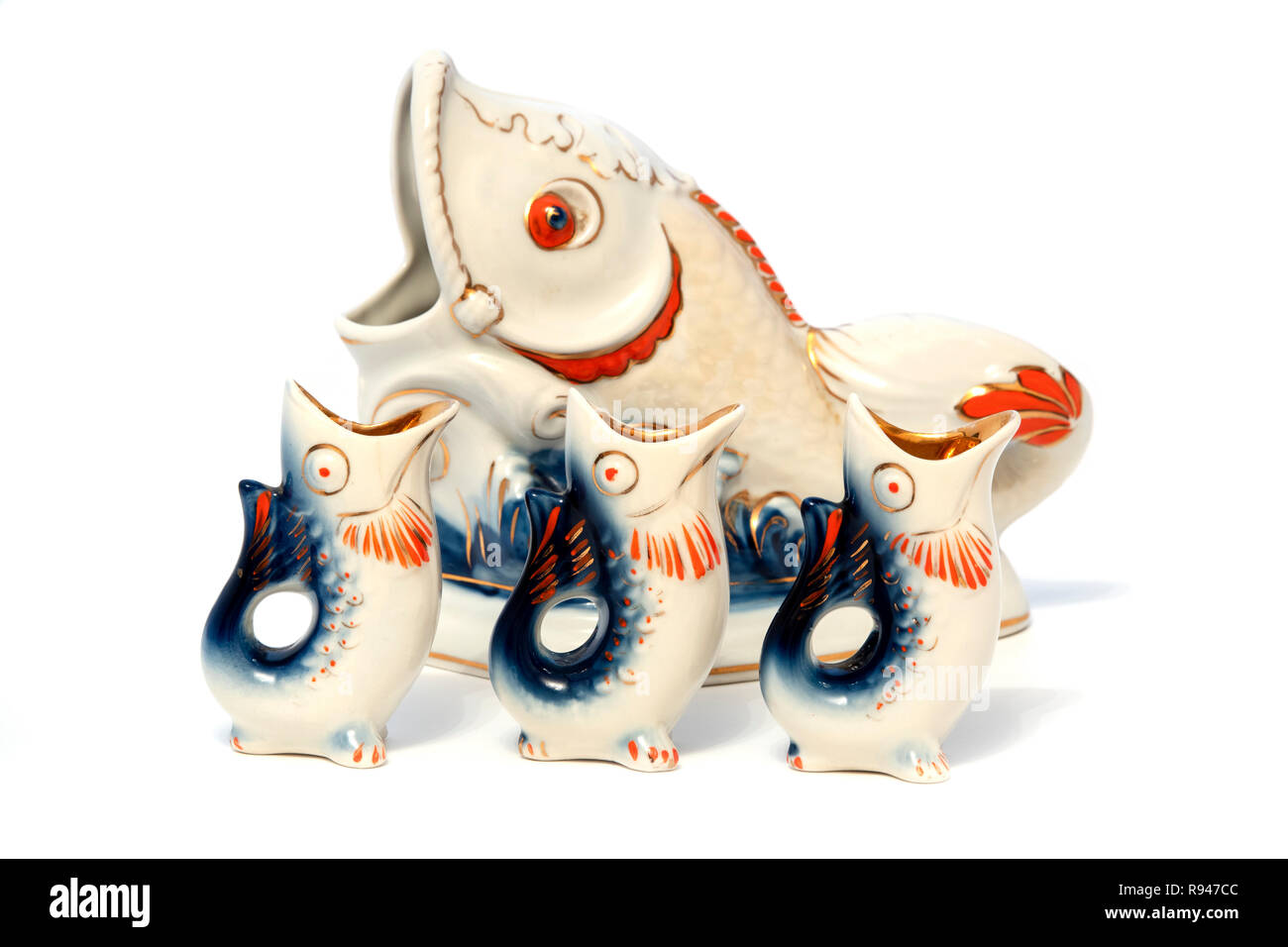 Vintage Soviet fish shaped decanter with shot glasses on a white ...