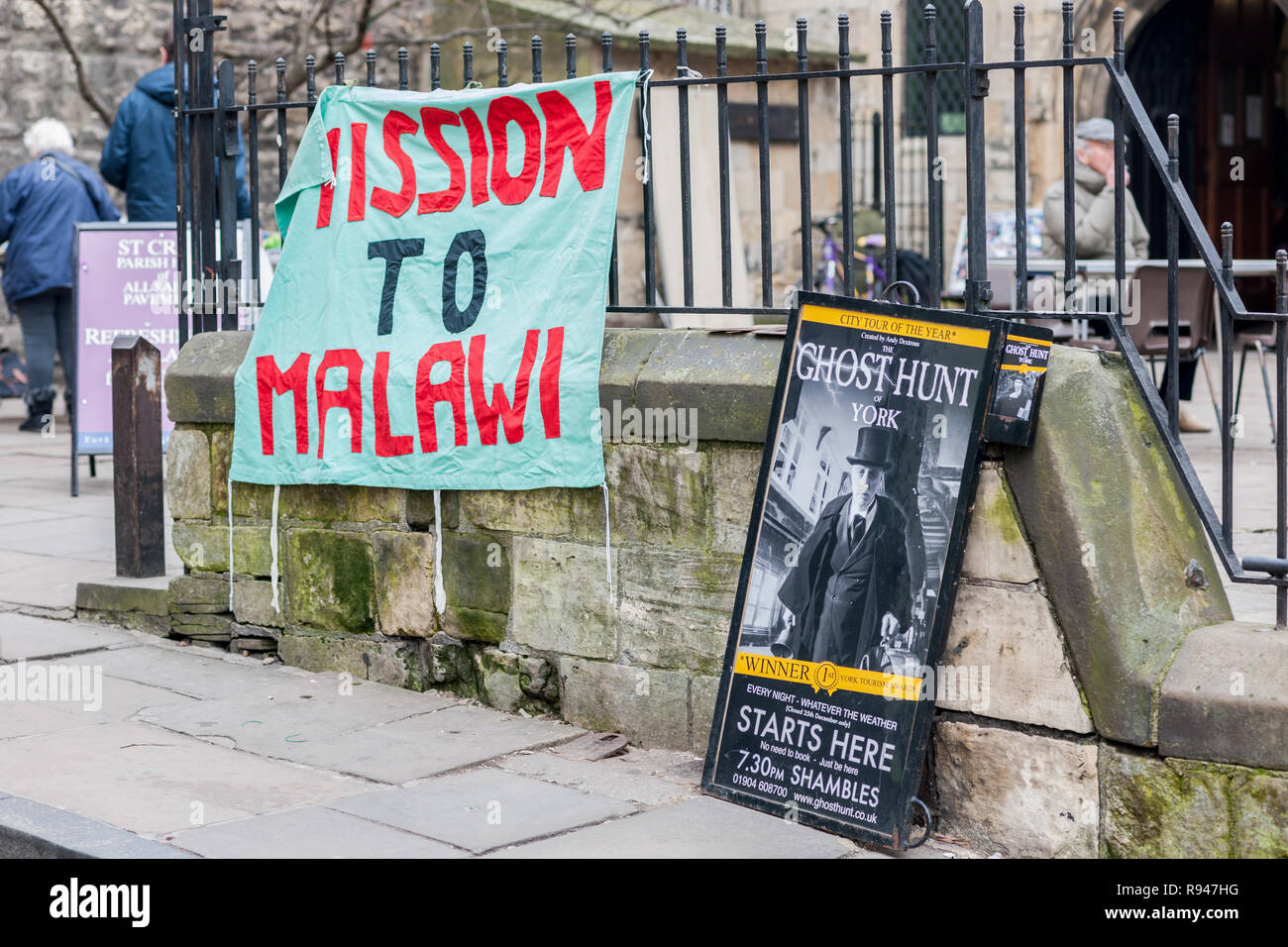 Missionary signs on church wall in York Stock Photo - Alamy