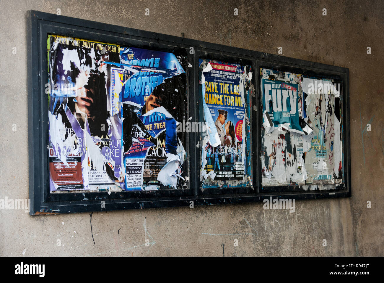 damaged posters in notice board Stock Photo - Alamy