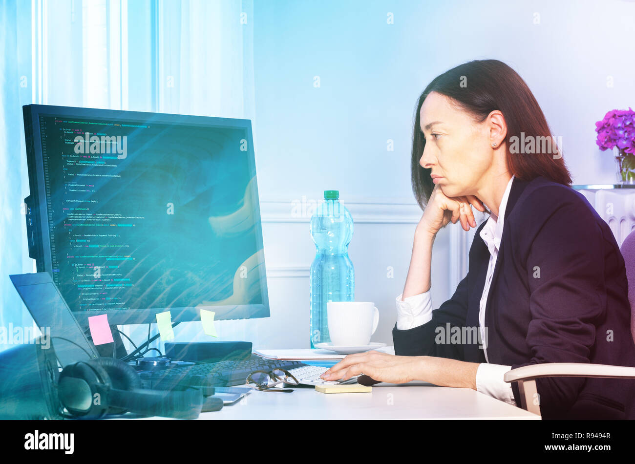 Side view portrait of upset businesswoman looking at the screen of ...