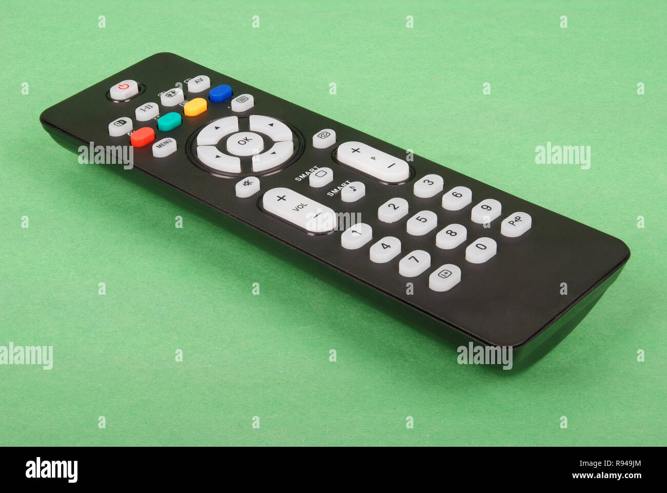 Black remote control for TV isolated on green background Stock Photo ...