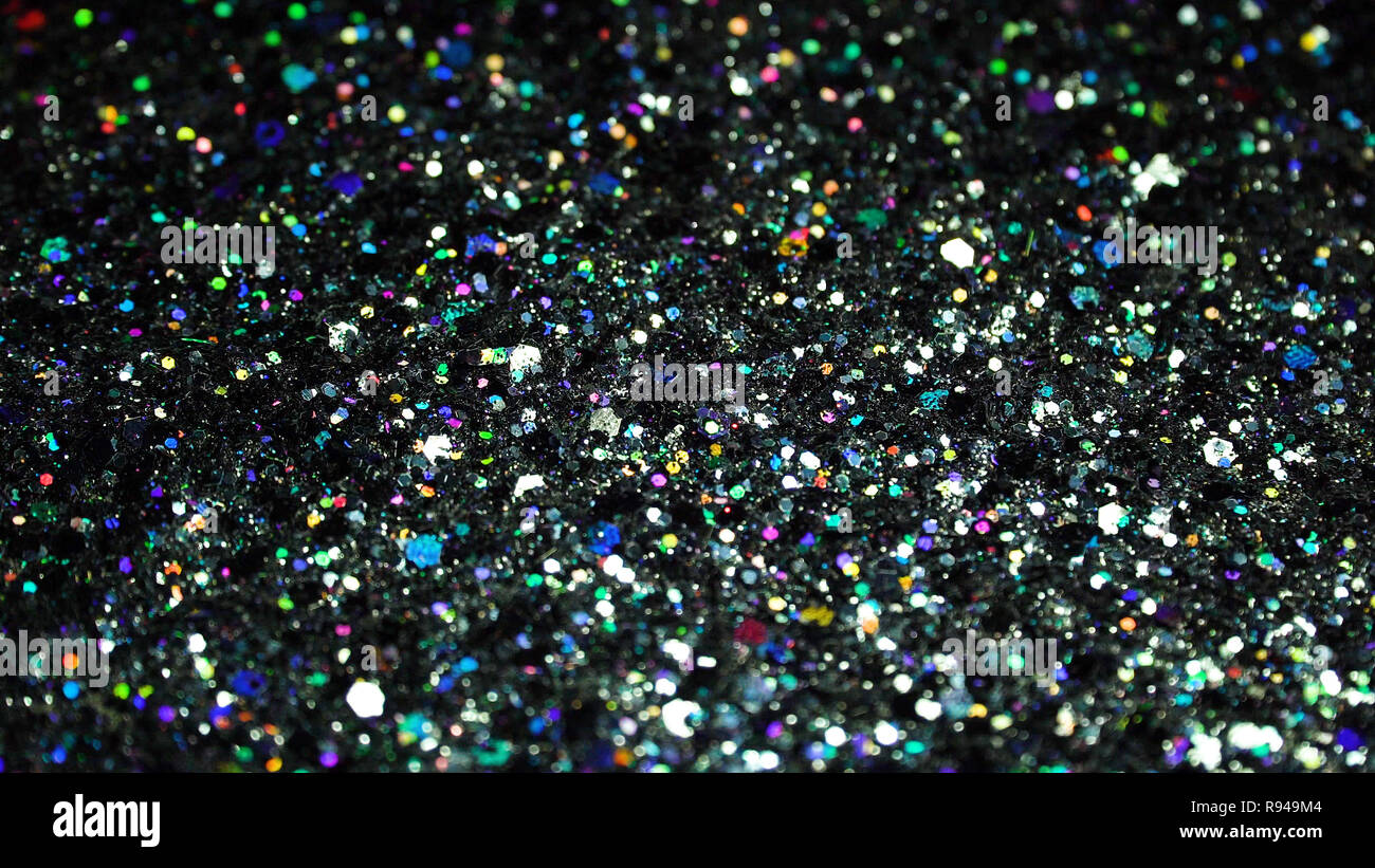 Black sparkling glitter in blur. Macro shooting Stock Photo - Alamy