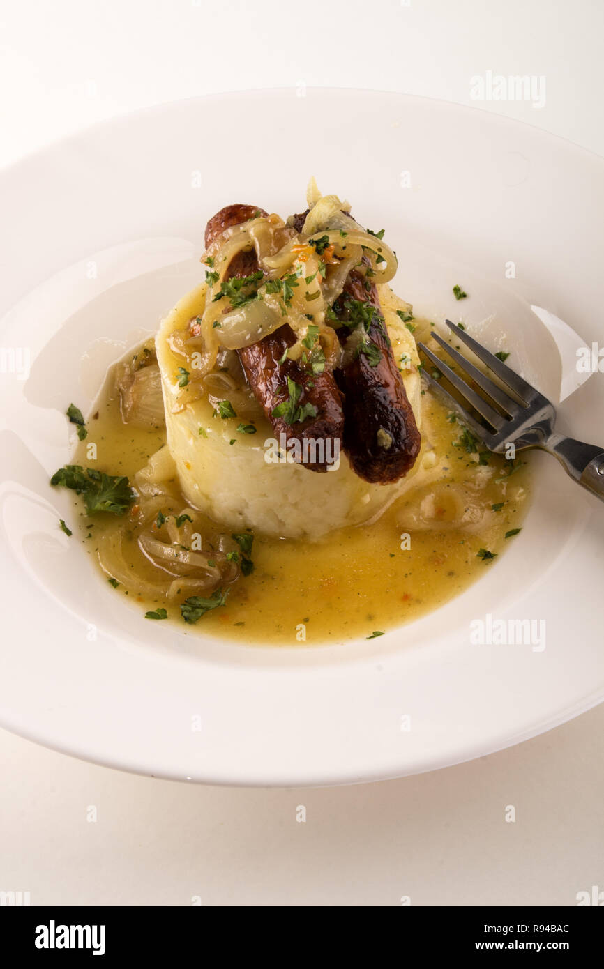 very irish specialty, fine dining, bangers and mash on a white plate ...